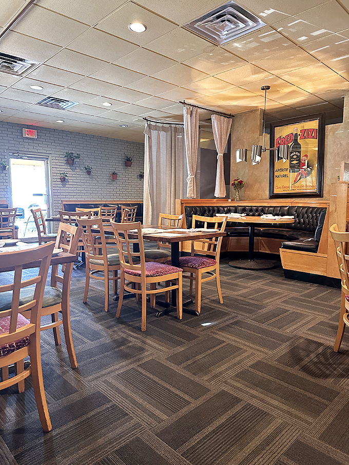 Cozy leather booths and wooden chairs create that perfect "neighborhood gem" atmosphere where conversations flow as freely as the wine.