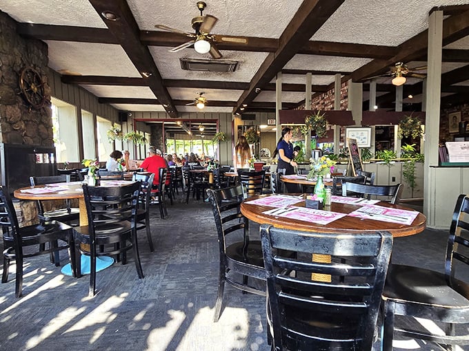 Wooden beams, nautical touches, and sunlight streaming through windows—this dining room feels like the cozy cabin of a ship that's permanently docked at Delicious.