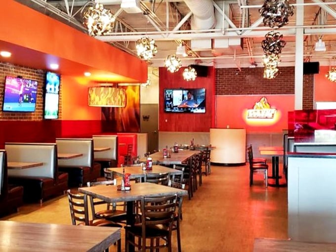 Red walls and industrial chic lighting create an atmosphere that says, "Yes, we take our burgers seriously, but we're still fun at parties."