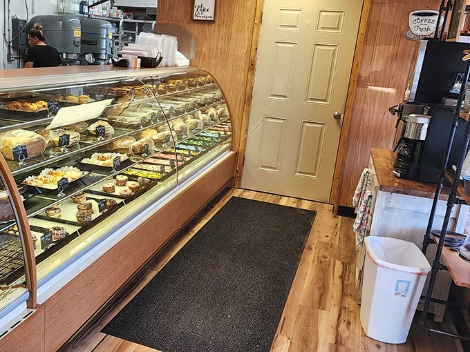 That display case isn't just showing pastries&mdash;it's exhibiting edible art. Each shelf tells a different delicious story.