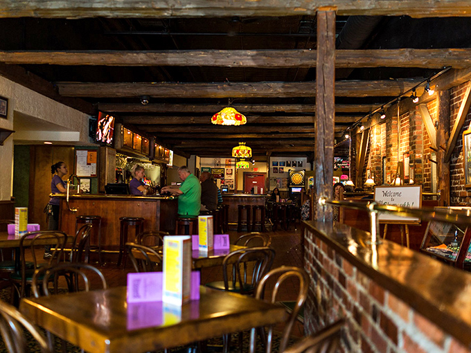Exposed wooden beams and warm lighting create the kind of atmosphere where strangers become friends and first-timers become regulars.
