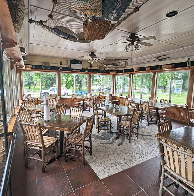 Fishing nets and crab traps dangle from the ceiling in this sun-drenched dining room, where every wooden chair has witnessed countless seafood celebrations.