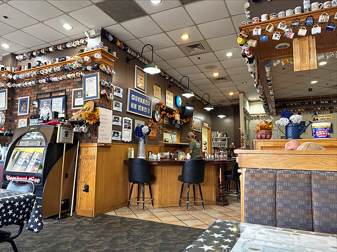 Coffee mugs from around the world create a cozy museum of satisfied customers.