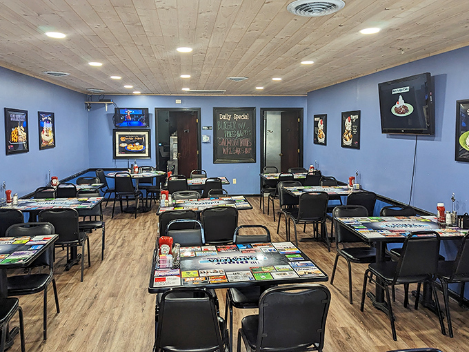 Blue walls, wooden ceiling, and tables covered with local ads create that perfect "everybody knows your name" small-town diner atmosphere.