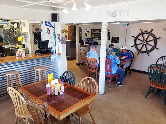 Inside, nautical charm meets no-nonsense dining. That ship's wheel isn't just decoration&mdash;it's steering you toward flavor country with every turn.