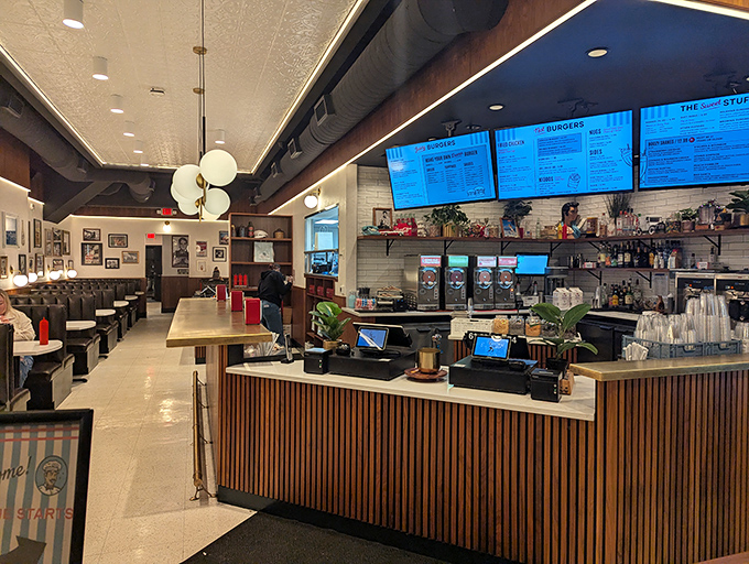 Modern nostalgia at its finest&mdash;sleek wood paneling meets digital menus in a space that feels both timeless and perfectly current.