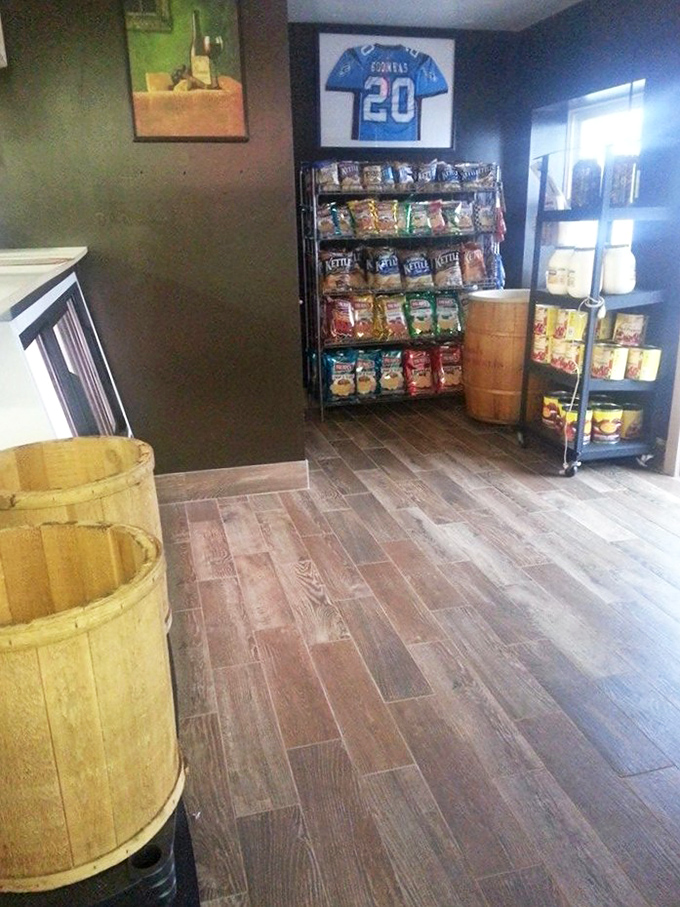Modern meets classic in this thoughtfully designed space. Metal dividers create semi-private dining nooks while red seat cushions pop against neutral walls.