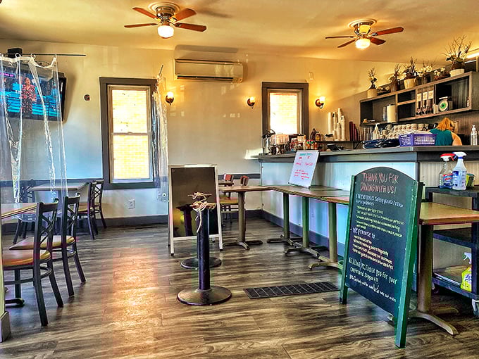 Warm wood floors, ceiling fans, and cozy seating create that "everybody knows your name" vibe. Sunlight streams in like it's auditioning for a role.