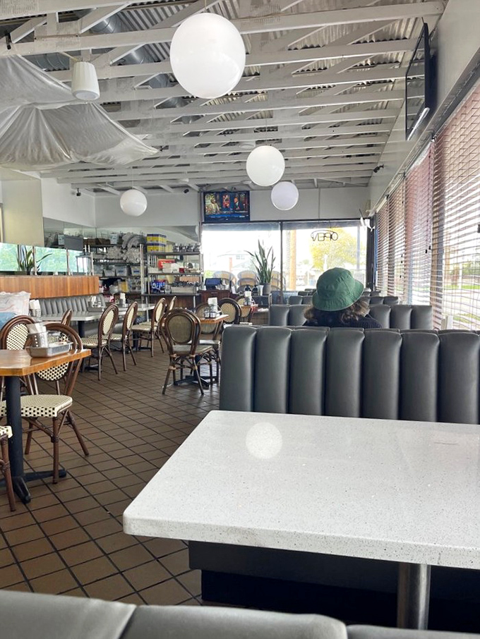 Inside, globe lights hang from exposed beams while comfortable booths invite you to settle in for a meal that prioritizes flavor over flash.