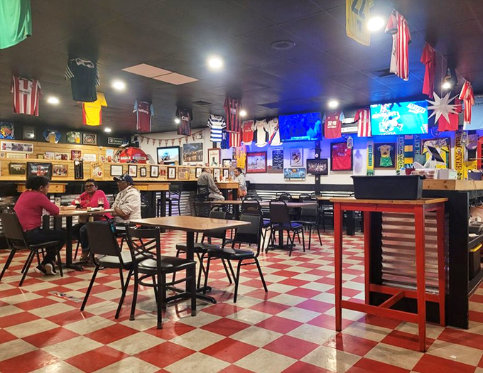 Modern circular booths create intimate dining islands in a sea of culinary possibilities. The contemporary ceiling fixtures cast a warm glow that says "stay awhile."