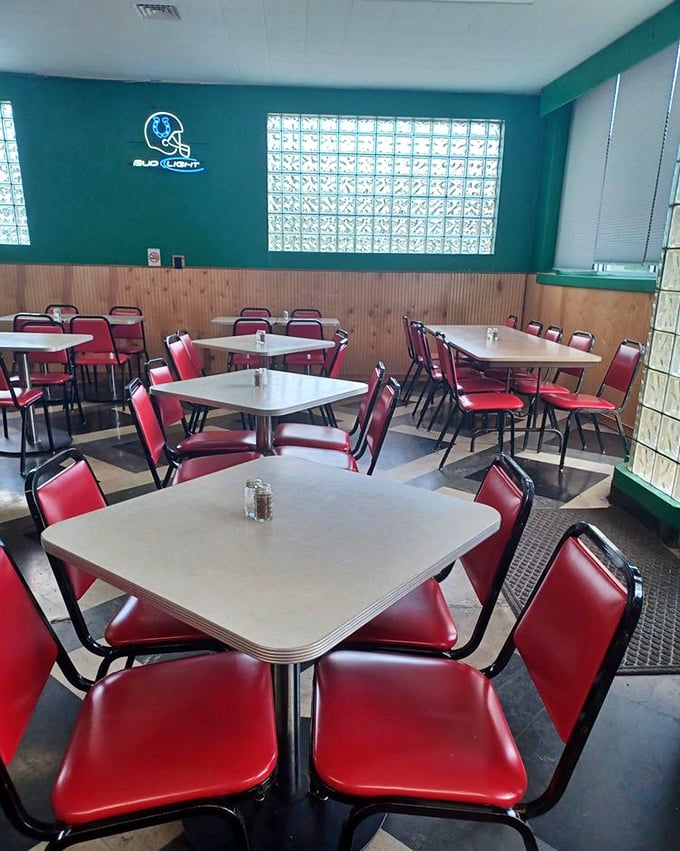Red vinyl chairs and laminate tables create the perfect no-nonsense dining atmosphere. This isn't Instagram-bait decor&mdash;it's the real deal, unchanged since your parents' first date.