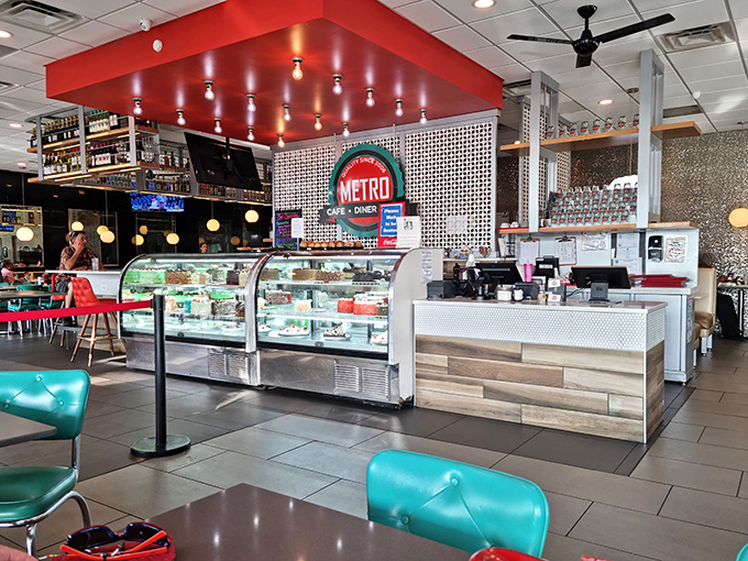 Step inside and the classic diner aesthetic gets a modern upgrade with that eye-catching red ceiling feature and gleaming display cases beckoning sweet-toothed visitors.