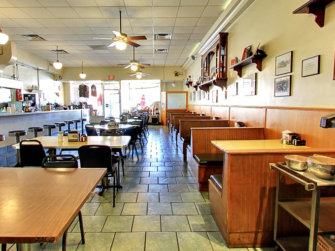 Classic diner DNA: booths, tiles, and that golden glow that says "breakfast served all day" in every language.