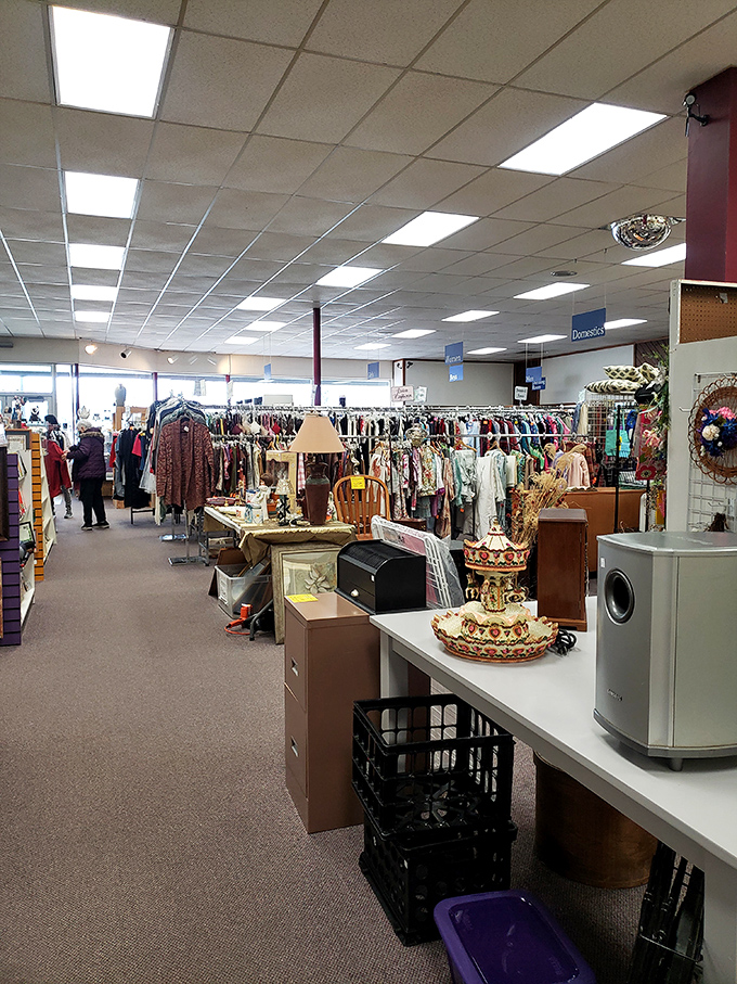 Organized chaos at its finest! Racks of clothing stand at attention while furniture and knickknacks create an obstacle course of possibility.