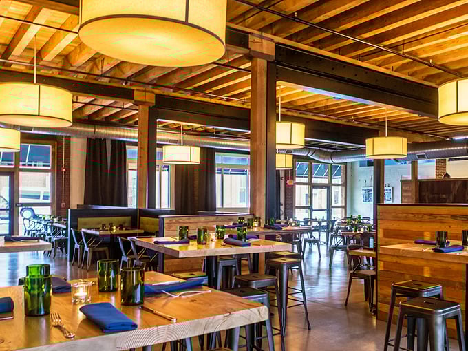 Wooden beams meet modern lighting in this thoughtfully designed space where conversations flow as freely as the locally-brewed beer.
