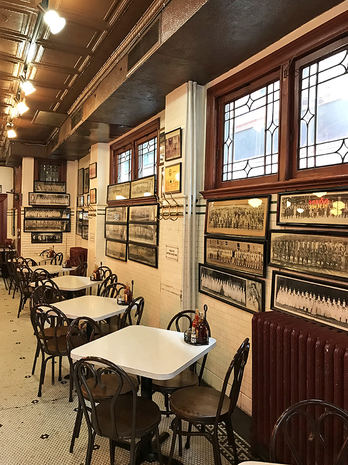 History lines these walls—vintage photographs tell Pittsburgh's story while those classic bentwood chairs have supported seafood lovers for generations.