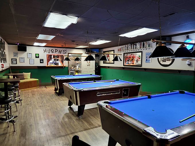 Pool tables dominate the back room, their blue felt surfaces practically begging you to pretend you're Minnesota Fats after your second Guinness.