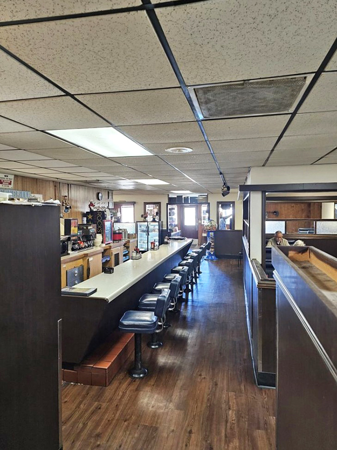 Counter seating with vintage swivel stools invites solo diners to enjoy a meal while watching the choreographed dance of diner service in action.