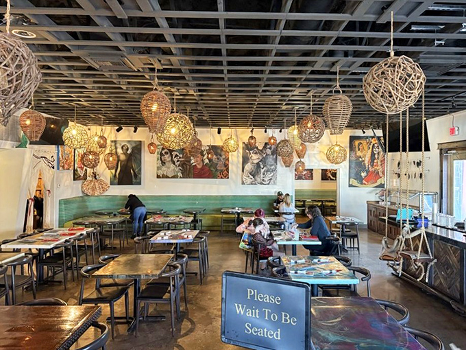 Woven basket light fixtures and vibrant artwork transform this dining room into a mini Mexican vacation. The "Please Wait To Be Seated" sign is just a formality—your nose will guide you.