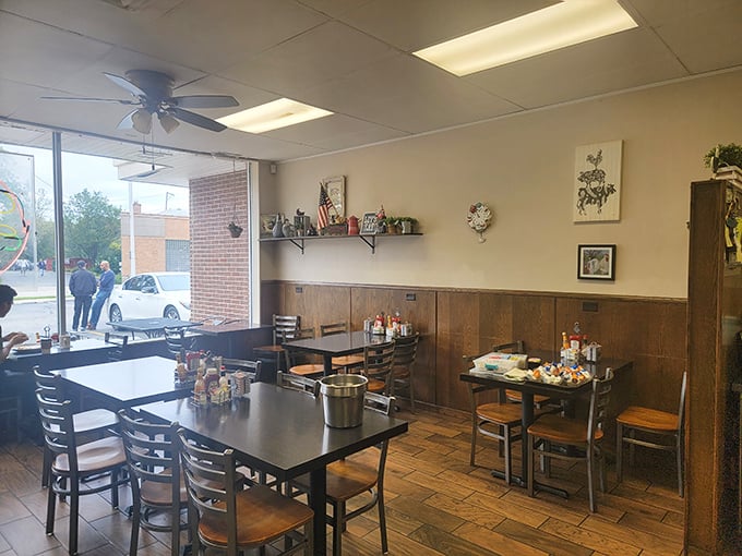 Wood paneling and ceiling fans create that classic diner vibe where conversations flow as freely as the coffee. Comfort begins before the food even arrives.