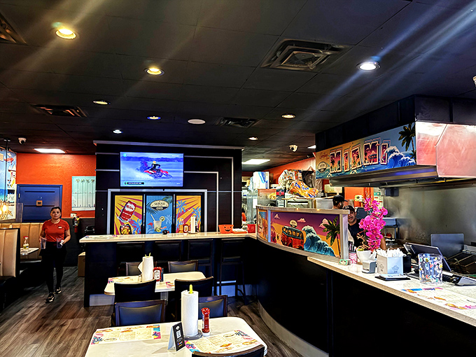 Vibrant walls and casual comfort create the perfect backdrop for sandwich excellence that locals guard jealously.