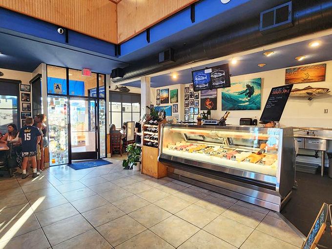 Step inside and the seafood showcase immediately announces: "This isn't your average fish joint." The blue ceiling and surfing artwork set the perfect San Diego mood.