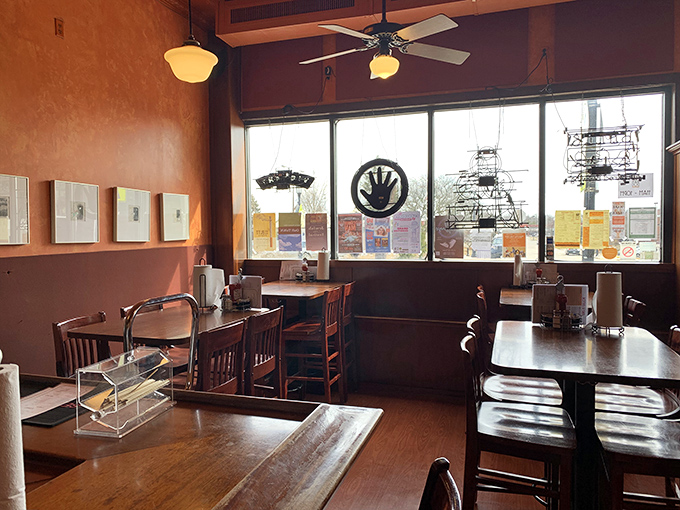 Warm orange walls and wooden tables create that perfect "come as you are" atmosphere where serious barbecue business happens daily.