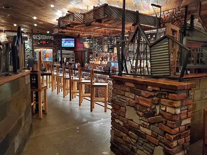 Industrial meets cabin chic in this thoughtfully designed interior. Brick pillars, corrugated metal, and wooden beams create the perfect backdrop for serious meat appreciation.