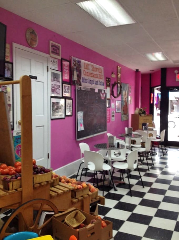 Pink walls and checkerboard floors create a diner wonderland that feels like stepping into a 1950s dream where calories don't count and pie is a food group.