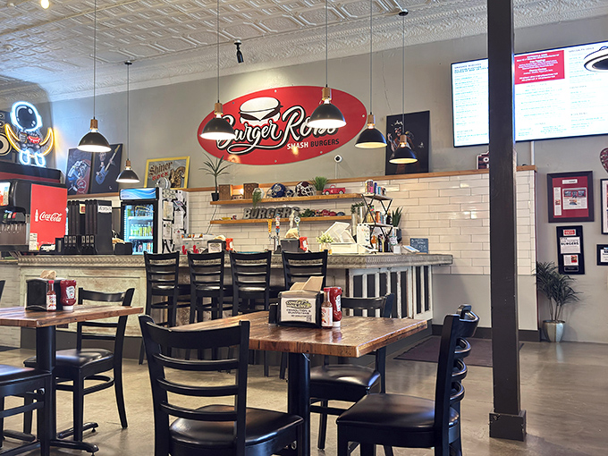 Inside, wooden tables and subway tiles create that perfect balance of modern charm and classic burger joint comfort.