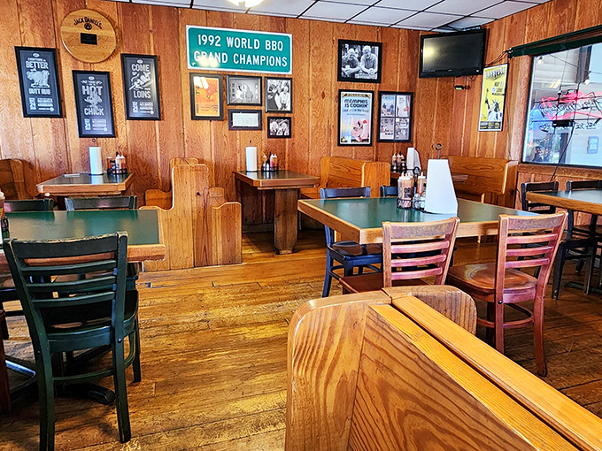 Trophy-lined walls tell stories of barbecue glory. That "1992 World BBQ Grand Champions" sign isn't just decoration&mdash;it's a promise.