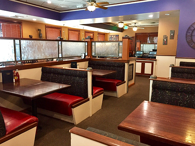 Cozy booths with rich purple accents invite you to settle in for a meal that transports you straight to the French Quarter.