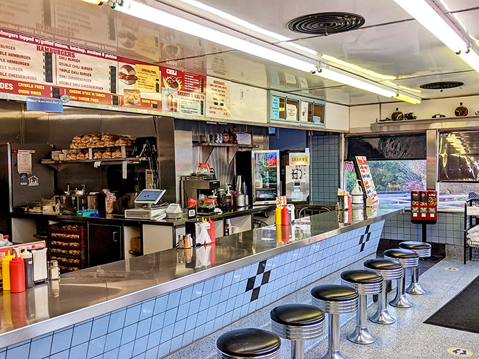 Classic counter seating with chrome stools invites you to belly up to burger paradise, where the sizzle of the grill provides the perfect soundtrack to your meal.