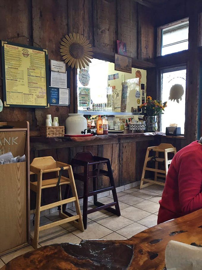 The classic diner-meets-cabin aesthetic creates that rare atmosphere where both hipsters and grandparents feel equally at home. Wood paneling never went out of style here. 