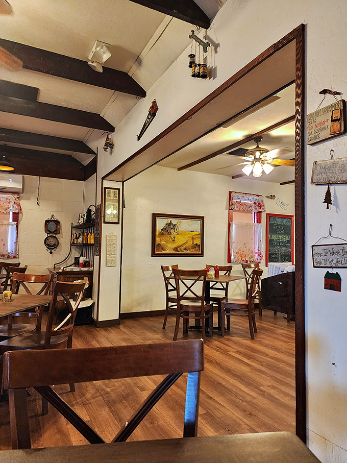 Wooden beams, cross-back chairs, and country charm create the perfect backdrop for conversations that flow as easily as the coffee refills.