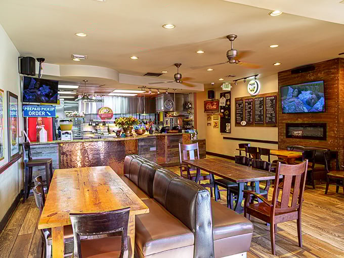 Rustic wooden tables, leather booths, and that copper-accented counter&mdash;comfort begins before the first bite even arrives.