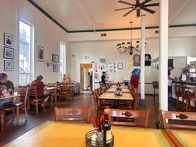 Simple wooden chairs, fish-adorned details, and ceiling fans spinning stories of the sea&mdash;Phil's interior feels like dining in a beloved captain's quarters.