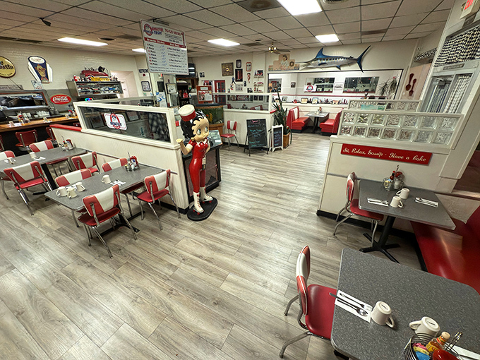 Step inside and time travel to an era when red vinyl booths weren't retro but simply practical, and the chef statue wasn't kitsch but aspirational.