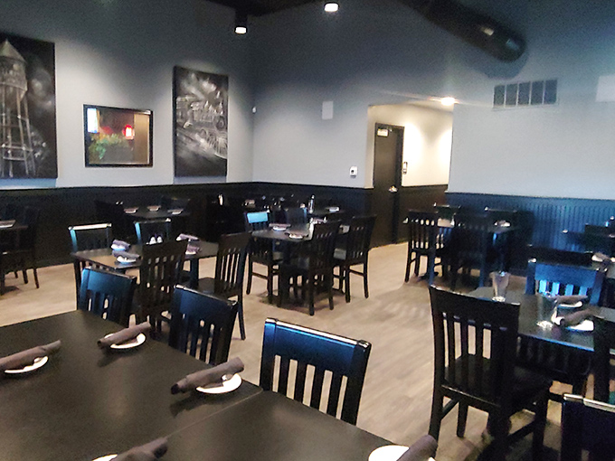 Clean lines, dark wood, and thoughtful lighting create an atmosphere that's both sophisticated and comfortable—like your favorite blazer but for restaurants.