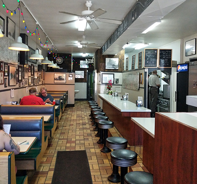 Step inside and time stands still. The vintage counter, well-worn booths, and colorful string lights create the perfect diner atmosphere.