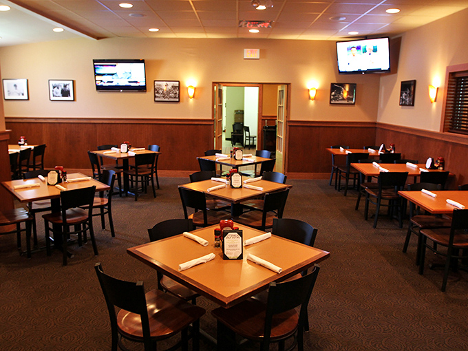 Classic wood paneling and strategically placed TVs create that perfect "everybody knows your name" vibe without going full Cheers. Comfort meets function in sports bar harmony.