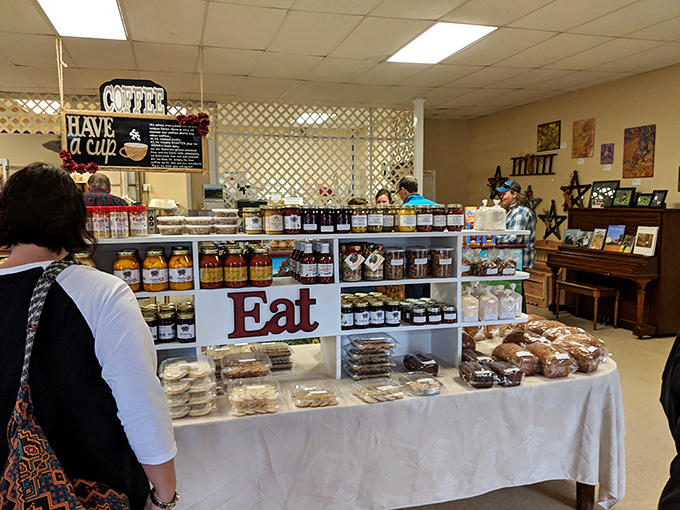 Shelves lined with homemade jams and fresh-baked goods create an edible gallery. That "EAT" sign isn't just a suggestion—it's the best advice you'll get today.