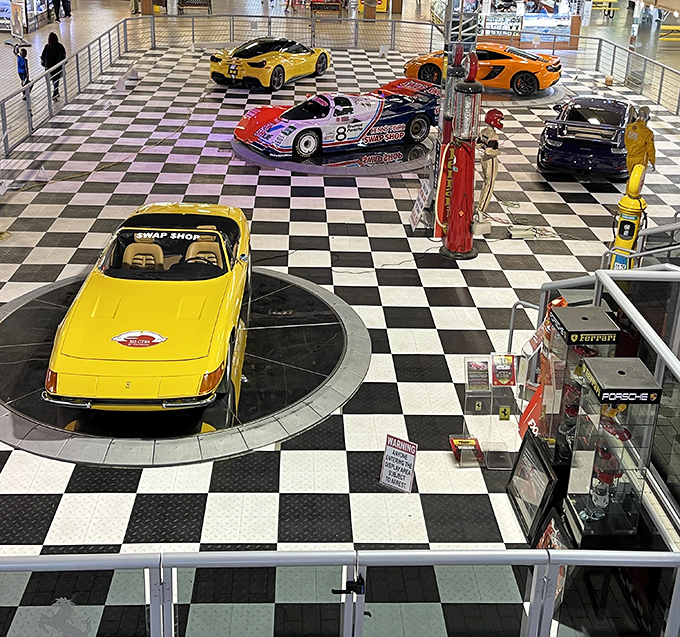Classic cars gleam like automotive jewelry on this checkered showroom floor that screams pure nostalgia.