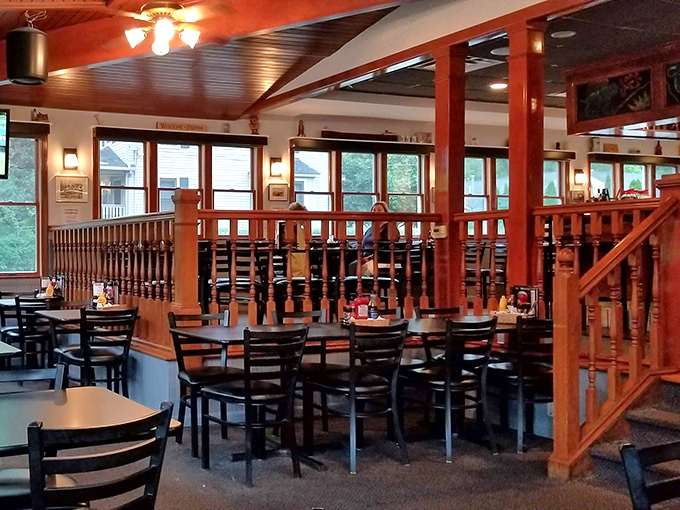 Warm wood tones and tiered seating create an atmosphere that's both cozy and spacious. Like a well-designed living room where someone happens to serve incredible food.