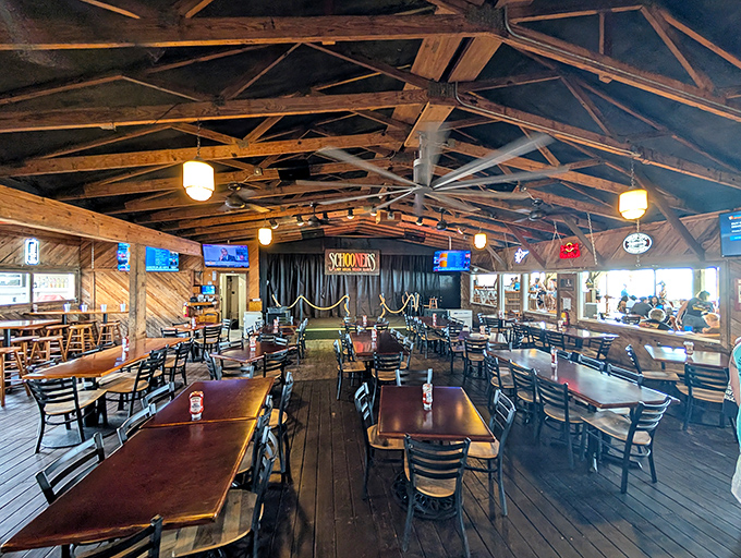 Step inside and the rustic wooden beams tell stories of countless sunsets celebrated, seafood feasts devoured, and beach memories made beneath this iconic roof. 