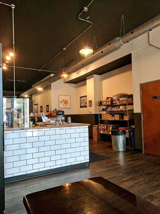 Industrial chic meets sandwich simplicity inside – exposed ductwork above, culinary magic below, and not a single unnecessary frill in sight.