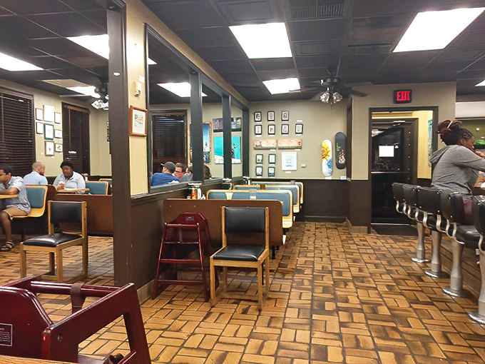 Classic diner ambiance meets Southern charm in this cozy interior. The wooden floor tiles and vintage counter stools tell you this place takes comfort seriously.