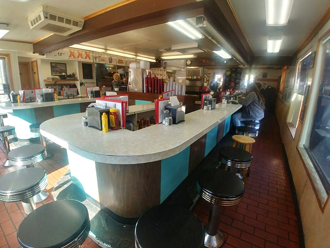 Step back in time at the horseshoe counter where spinning stools make everyone feel eight years old again, no matter what your driver's license claims.