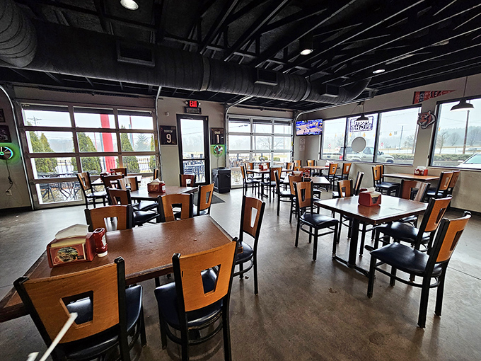 Industrial-chic meets comfort in this dining room where the exposed ductwork and concrete floors say, "We're serious about the food, not the decor."