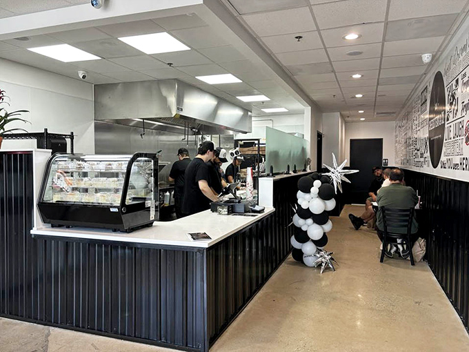 Simplicity reigns inside where the focus is clear: craft perfect cheesesteaks while customers eagerly await their paper-wrapped treasures.
